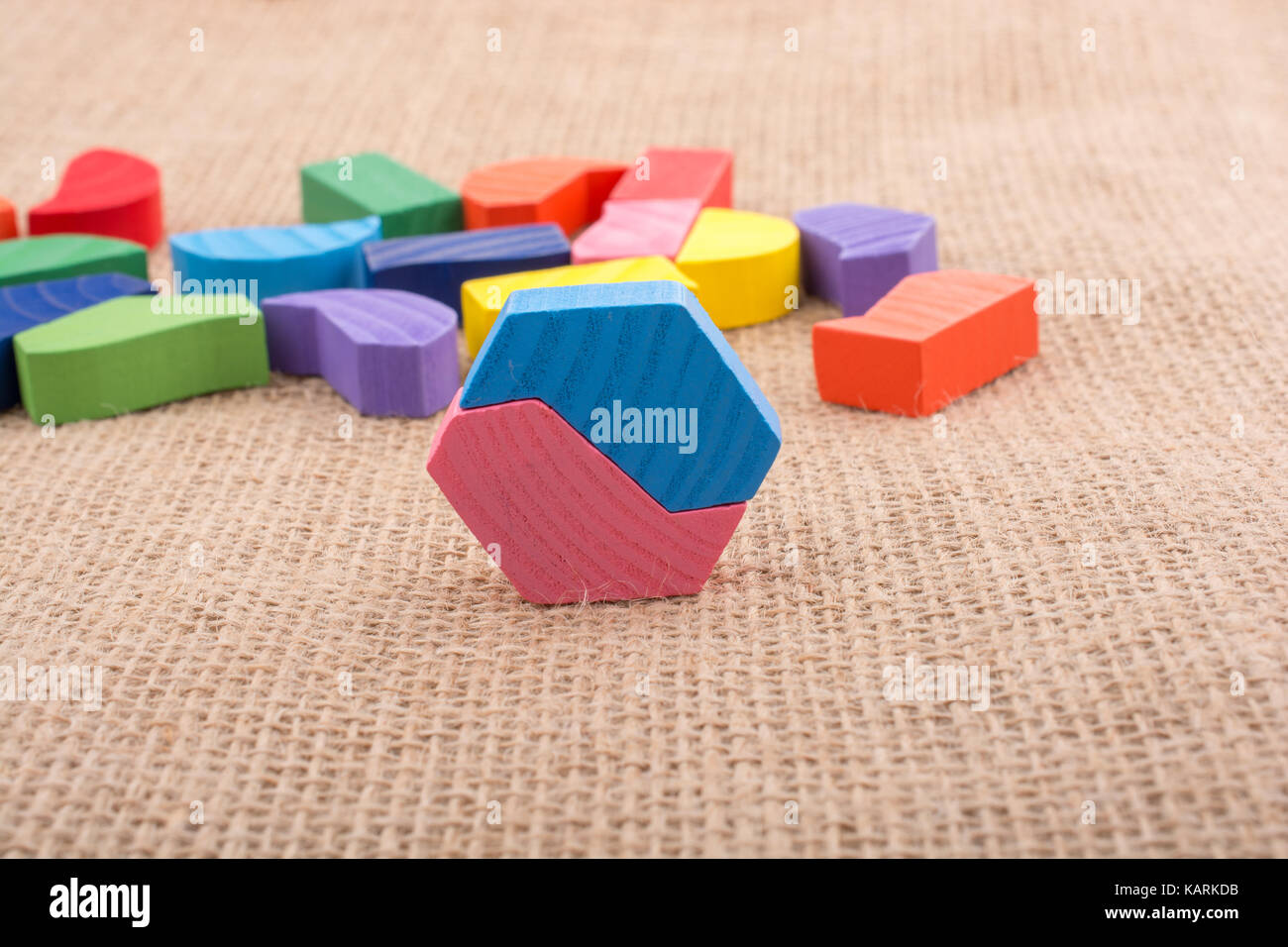 Colorful wooden pieces of a logic puzzle Stock Photo - Alamy