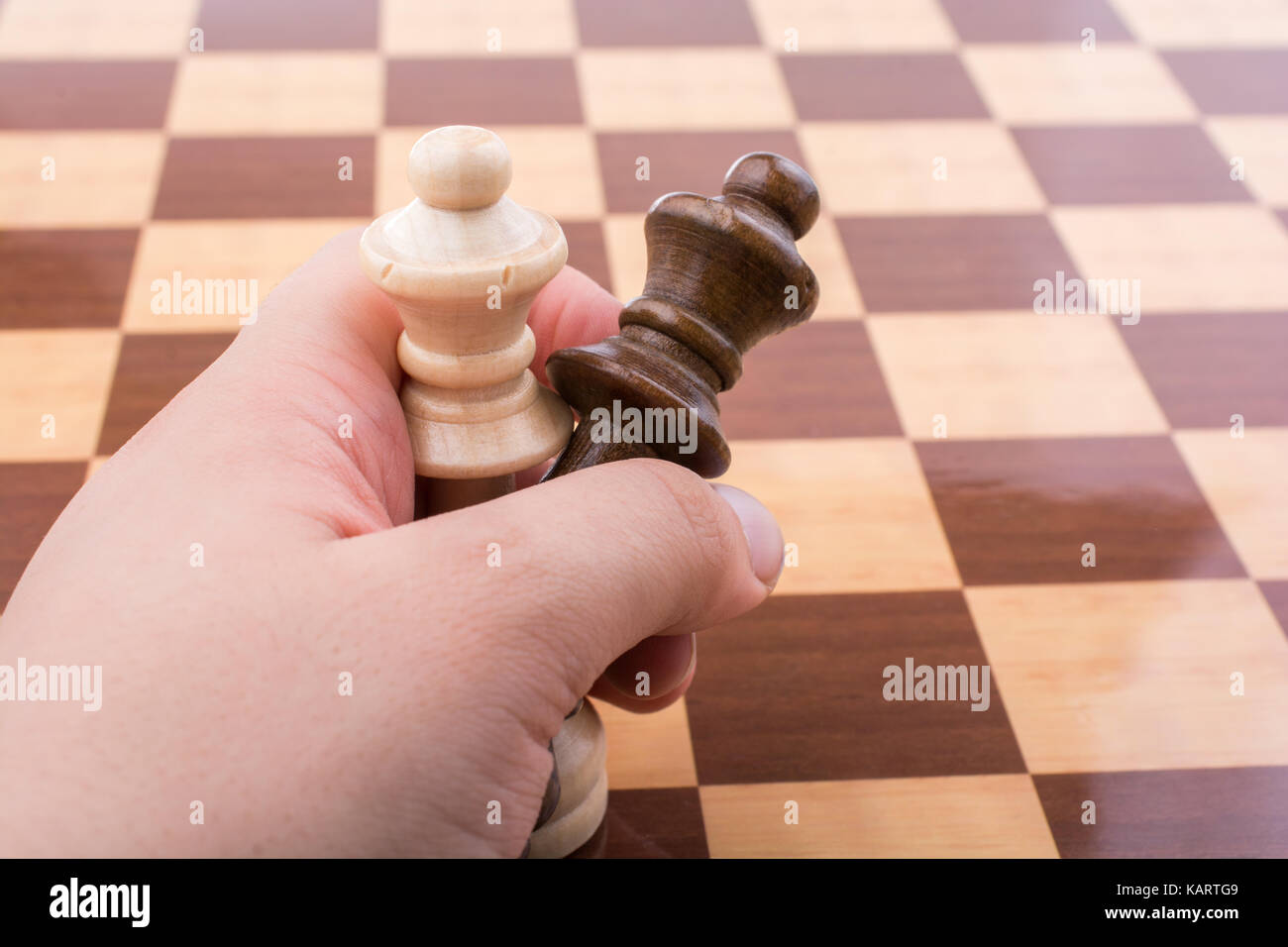 Person playing chess game making a move on board Stock Photo - Alamy