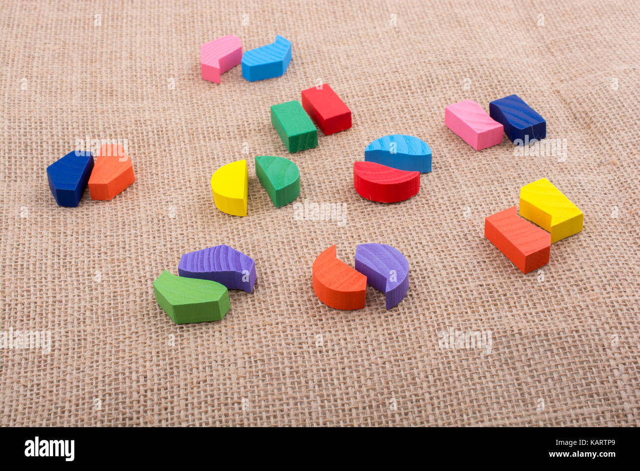 Colorful wooden pieces of a logic puzzle Stock Photo - Alamy