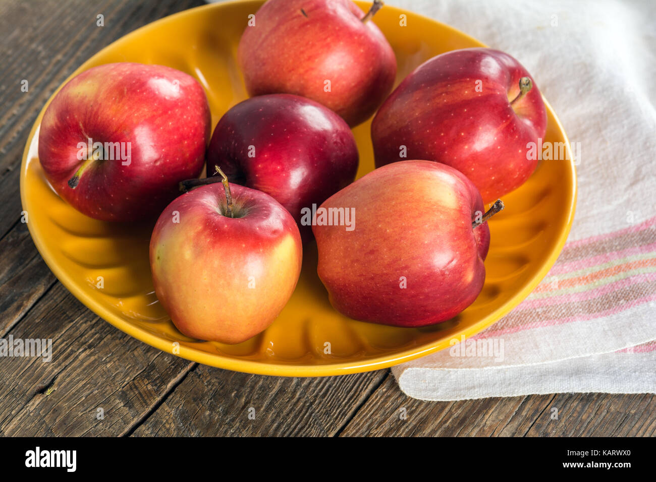 Ripe red apples on plate Stock Photo - Alamy