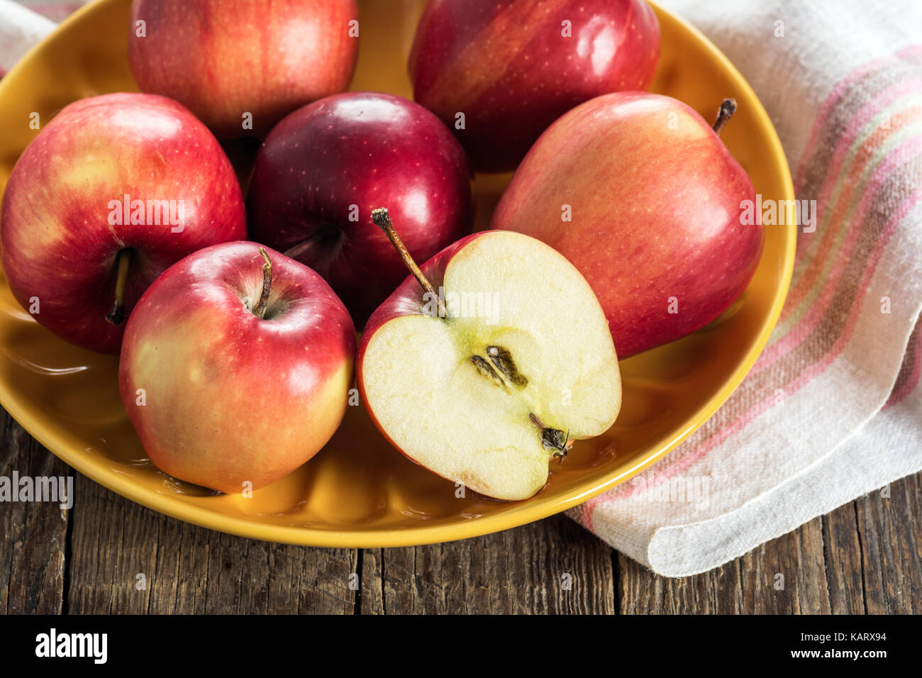 Ripe red apples on plate Stock Photo - Alamy