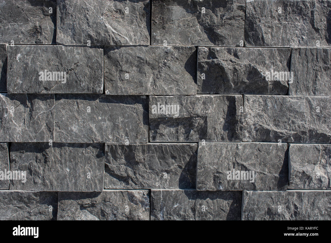 Decorative cubic stone wall as background texture Stock Photo - Alamy