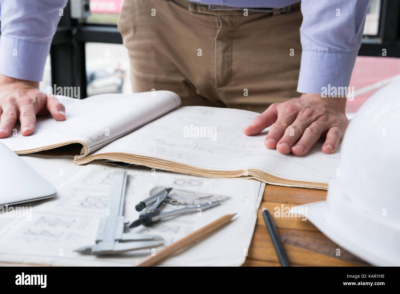 architect working on construction plan at office. engineer inspect ...