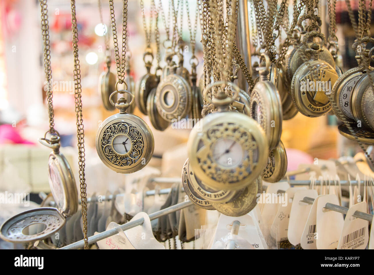 Set of retro styled pocket watches hanging Stock Photo - Alamy
