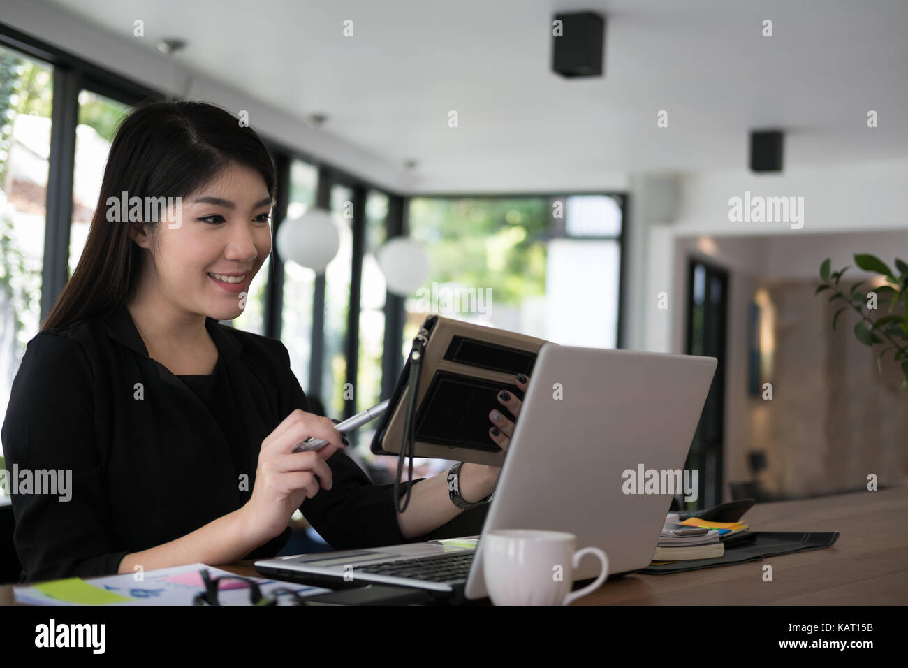 businesswoman use tablet at workplace. young woman working on touchpad ...