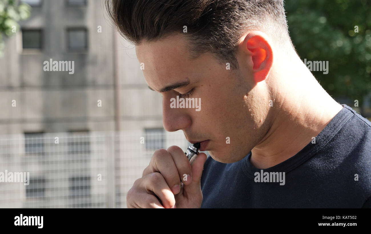 Man vaping in street hi-res stock photography and images - Alamy