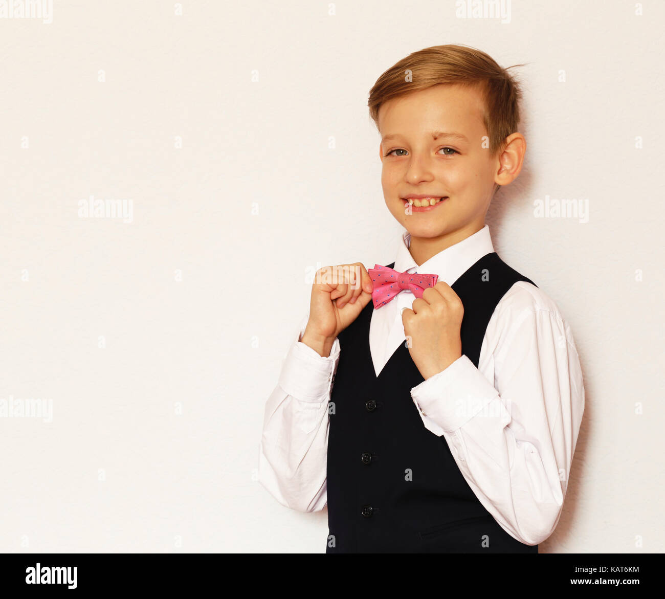 portrait of a boy in a classic suit with a bow tie Stock Photo - Alamy