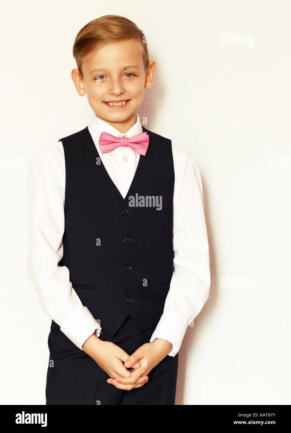 portrait of a boy in a classic suit with a bow tie Stock Photo - Alamy