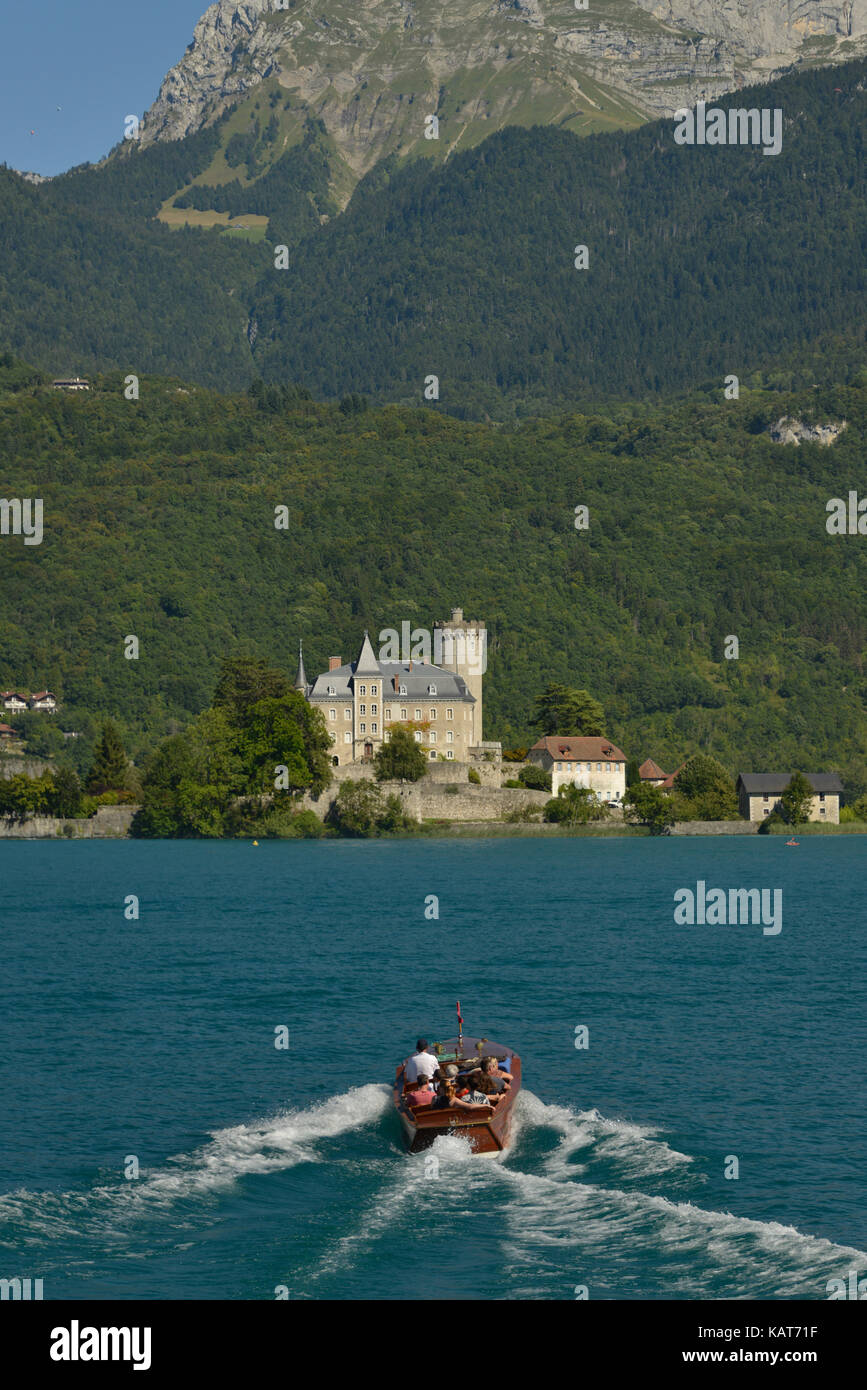 Medieval chateau on Lake Annecywith a mountainous background, Annecy ...