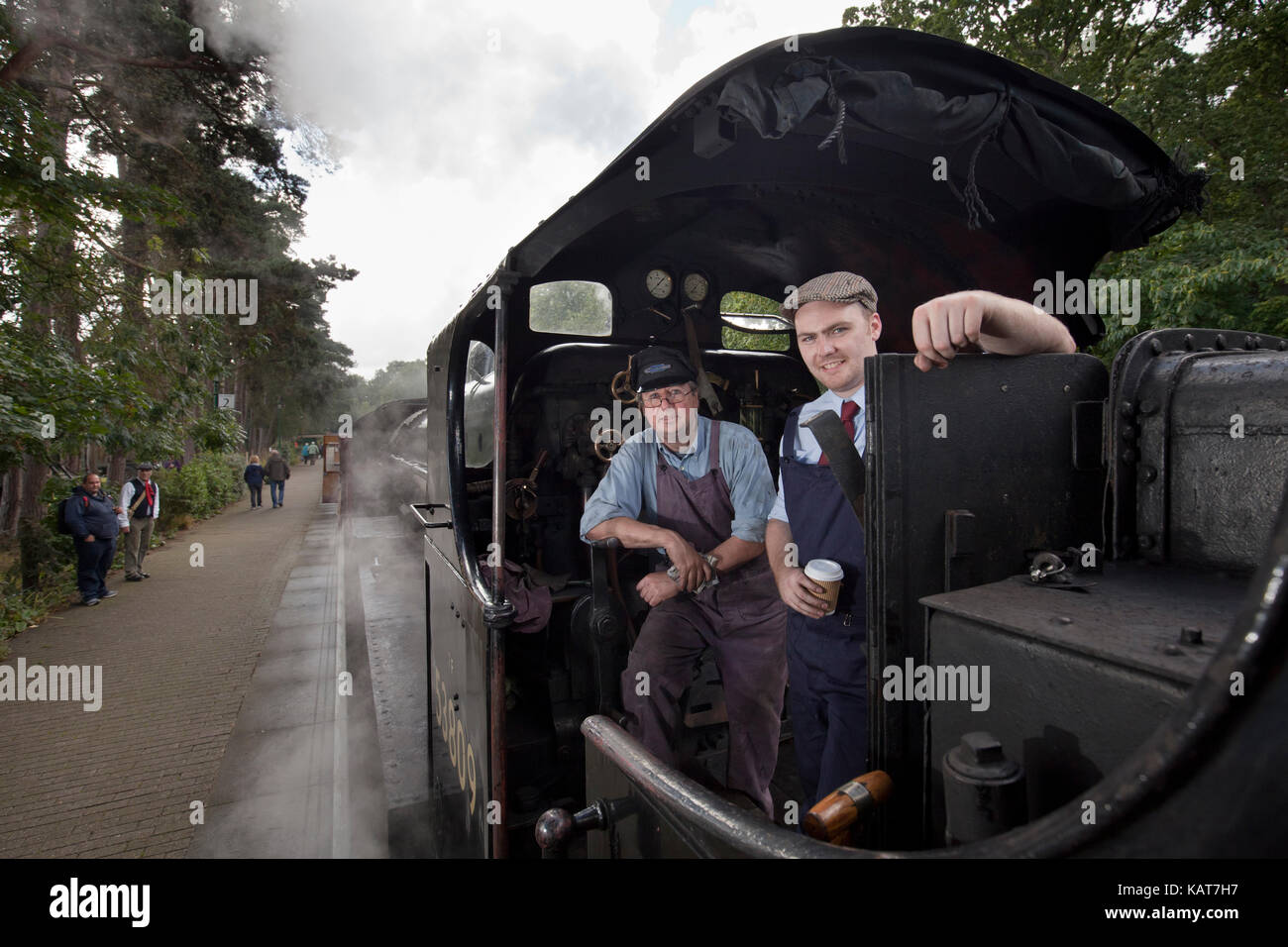 North Norfolk Railway steam engine driver and fireman take a break at ...