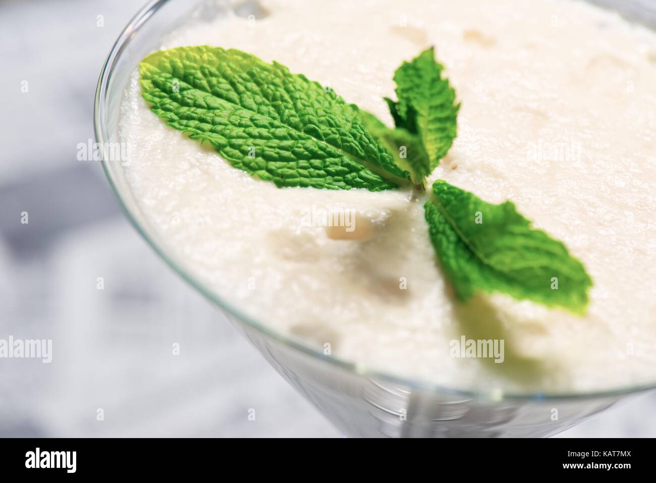 Closeup of a coconut milkshake Stock Photo - Alamy