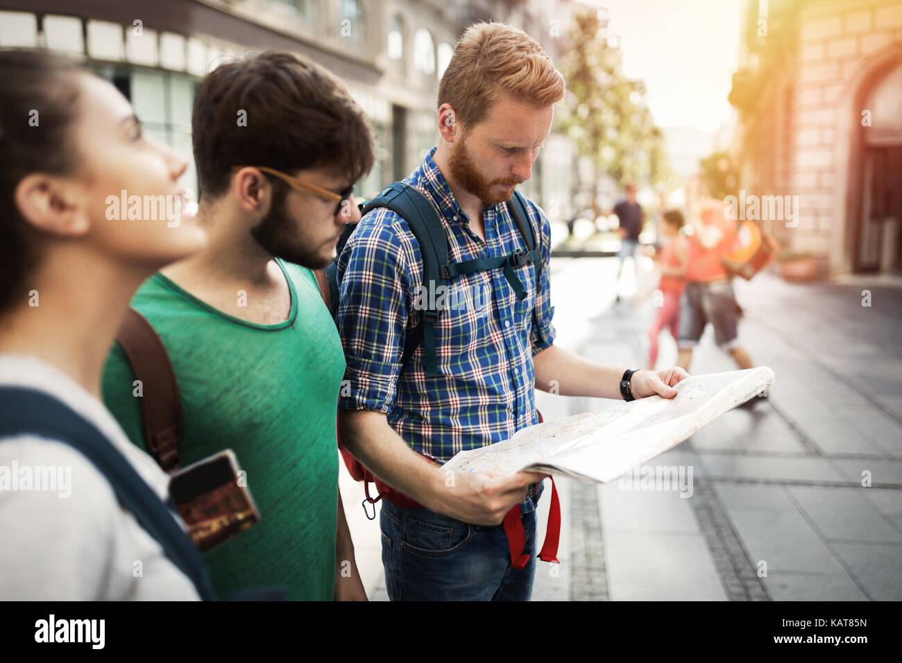 Young happy tourists sightseeing in city Stock Photo - Alamy