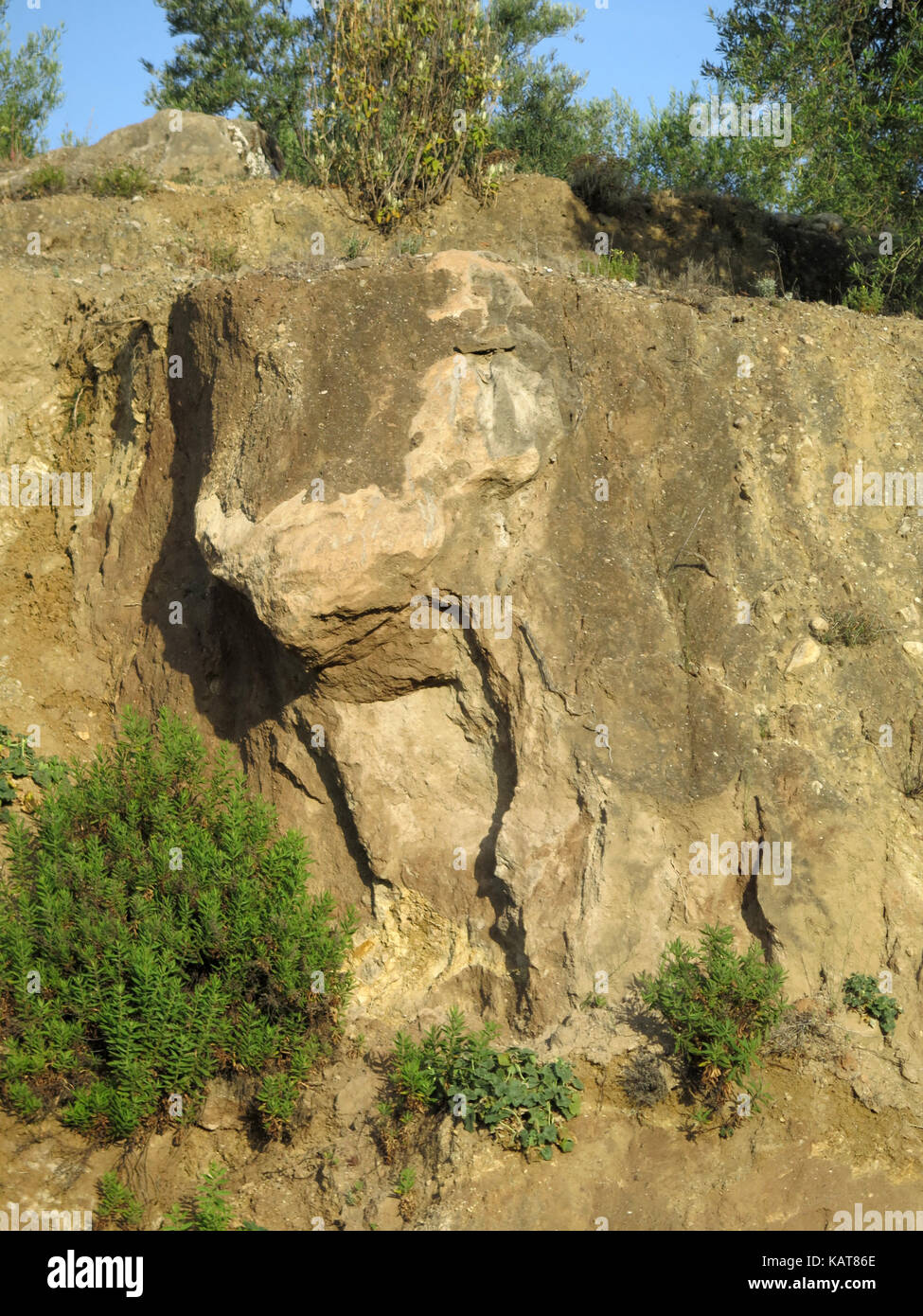 Rock face with big nose on roadside embankment near Andalusian Village ...