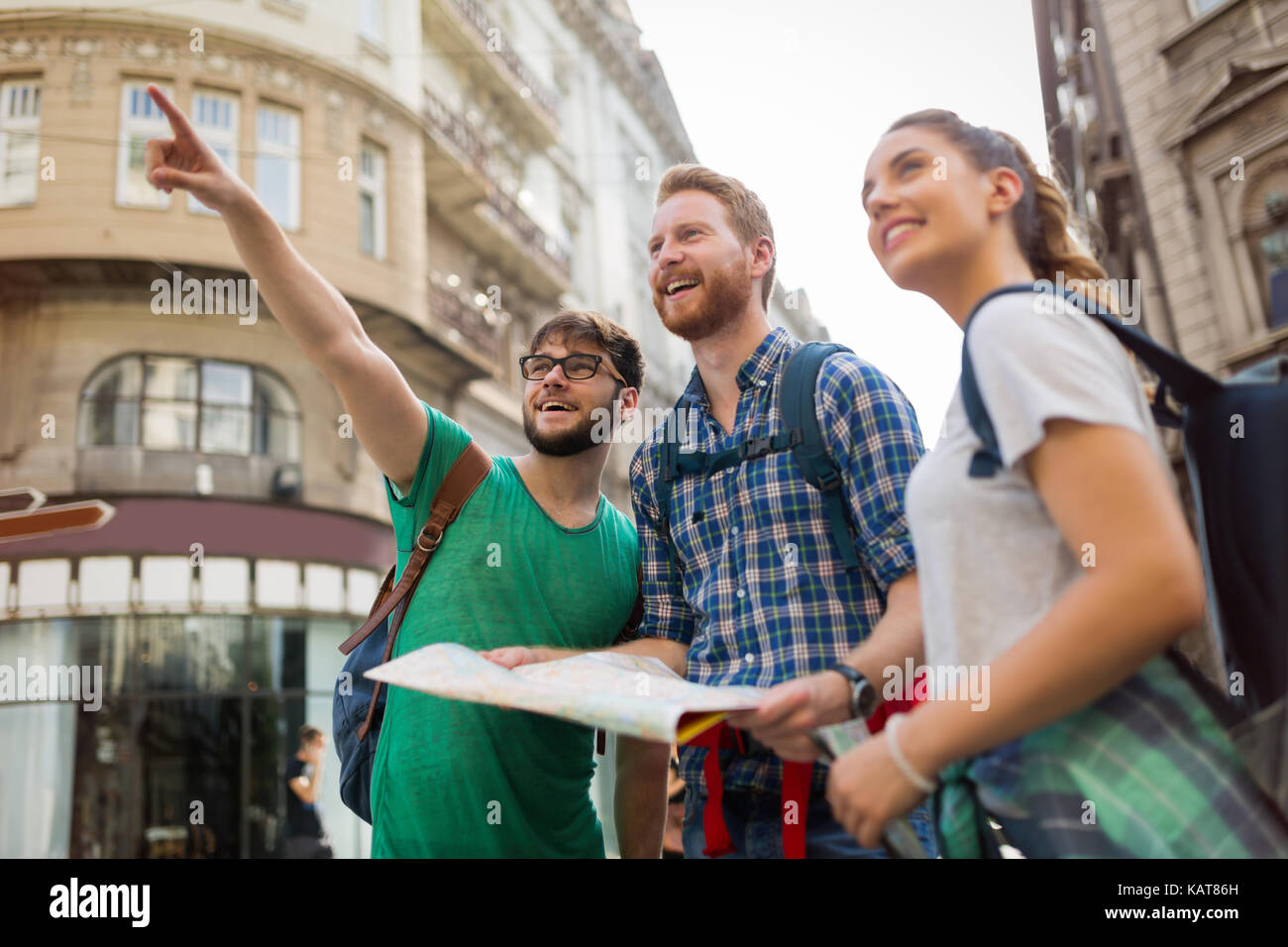 Happy group of tourists traveling and sightseeing Stock Photo - Alamy