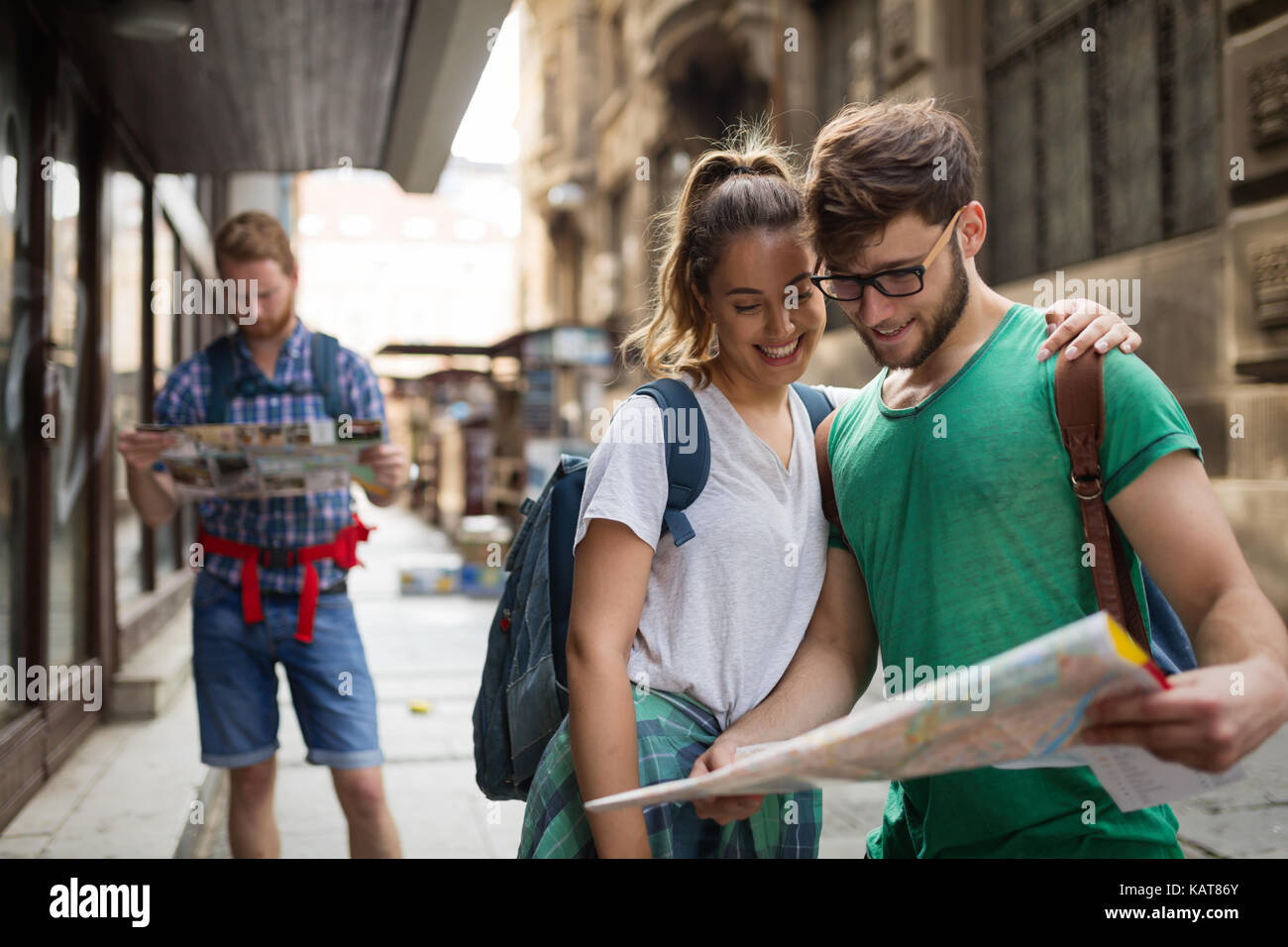 Young happy tourists sightseeing in city Stock Photo - Alamy