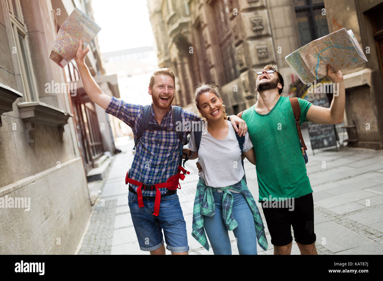 Young happy tourists sightseeing in city Stock Photo - Alamy