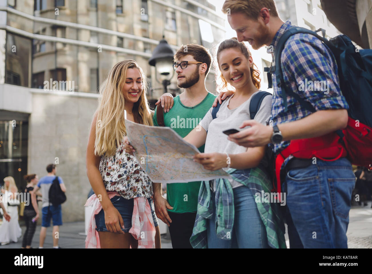 Happy group of tourists traveling and sightseeing Stock Photo - Alamy