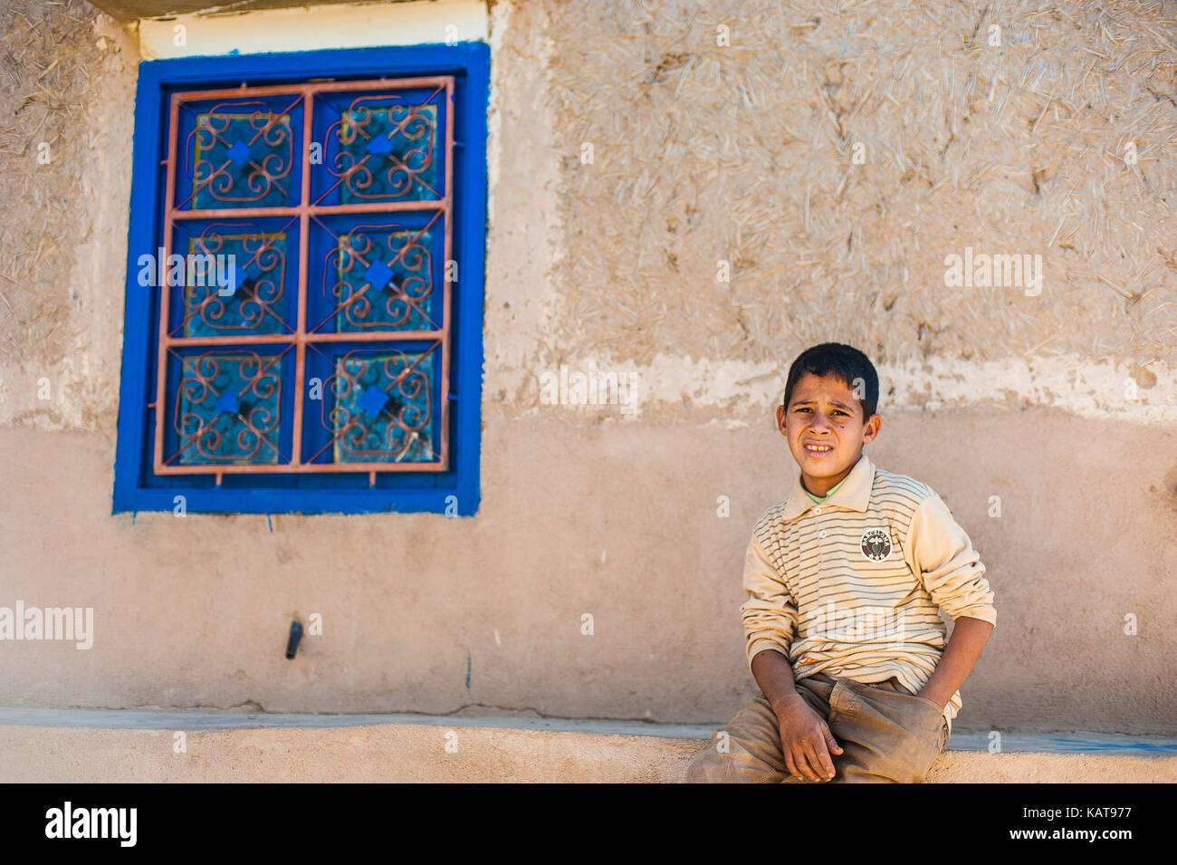 Boy at the front of the house Stock Photo - Alamy