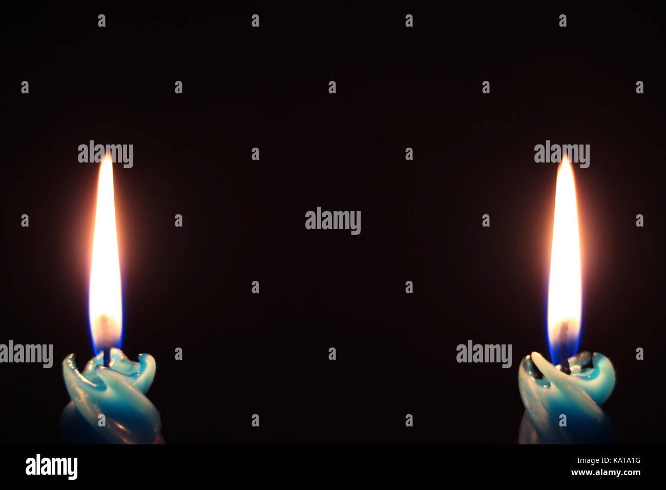 Pair of Burning Blue Candles Isolated On Black Background Stock Photo ...