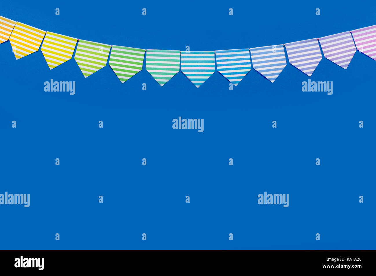 Colored flags garland. The background is blue . celebration Stock Photo ...