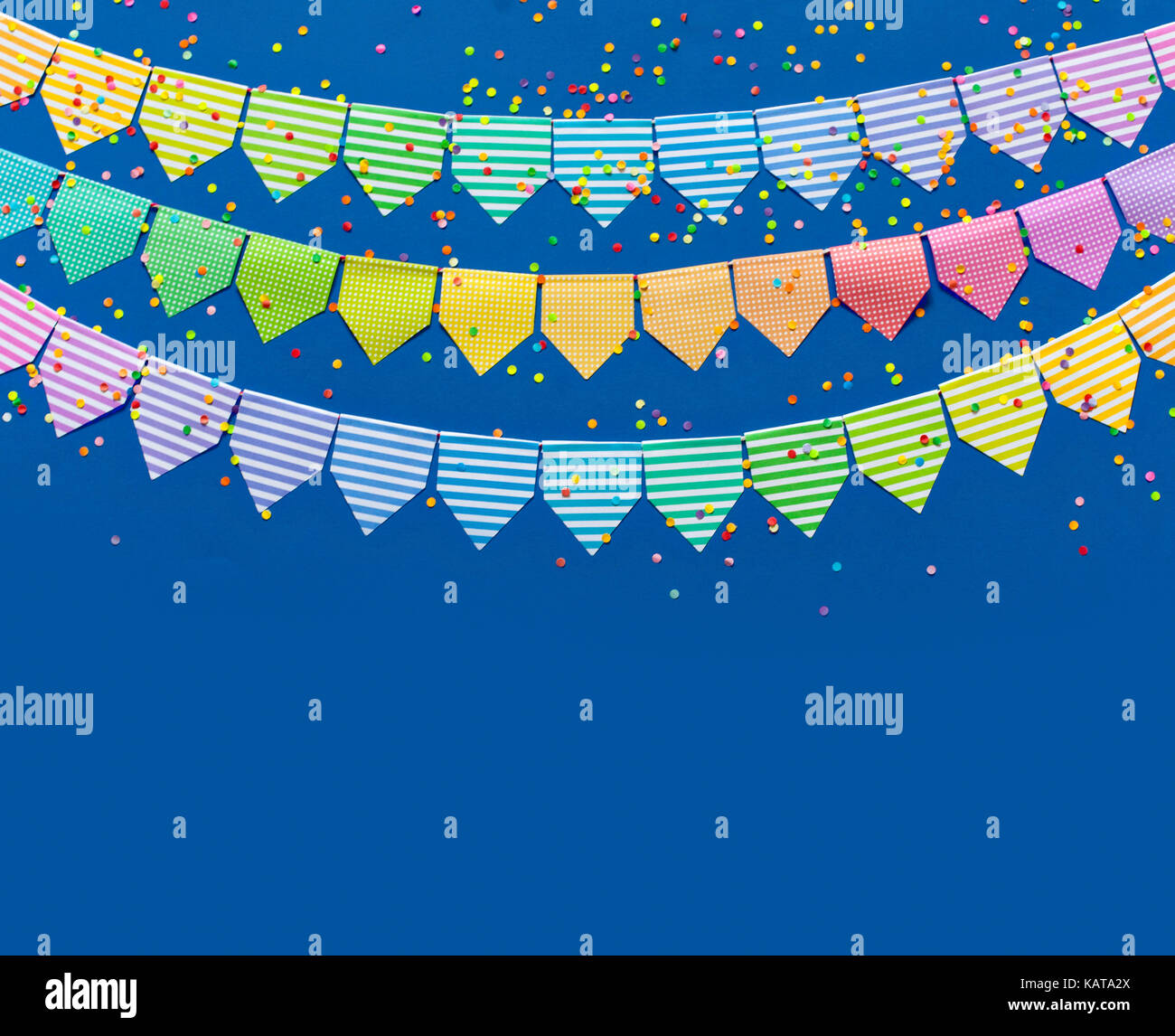 Colored flags garland. The background is blue . celebration Stock Photo ...