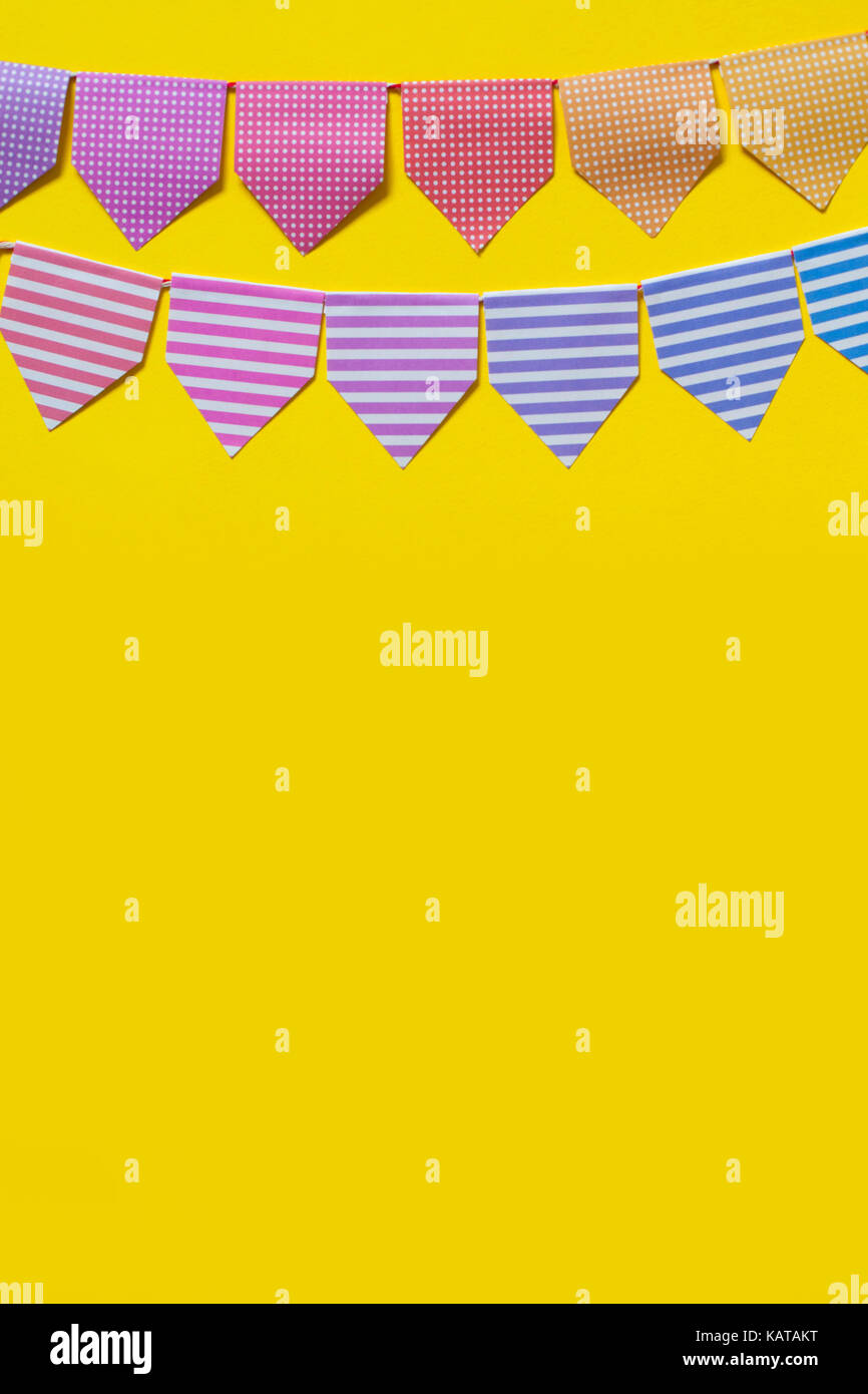 Colored flags garland. The background is yellow. celebration Stock ...