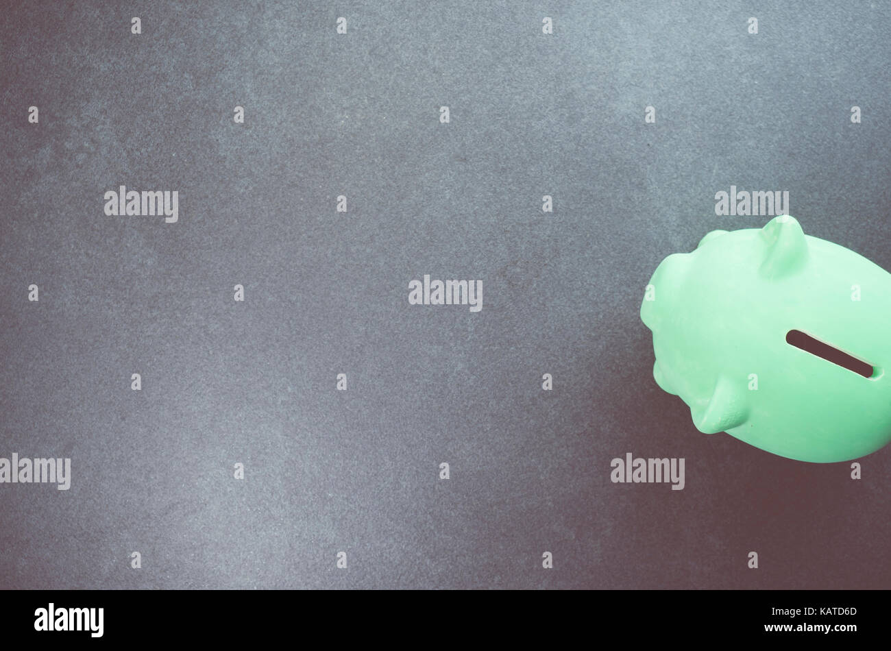 terracotta piggy bank on a stone background - top view Stock Photo - Alamy