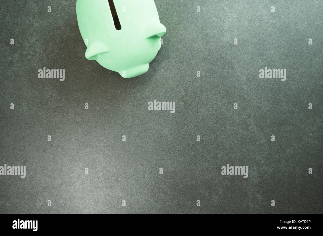 terracotta piggy bank on a stone background - top view Stock Photo - Alamy