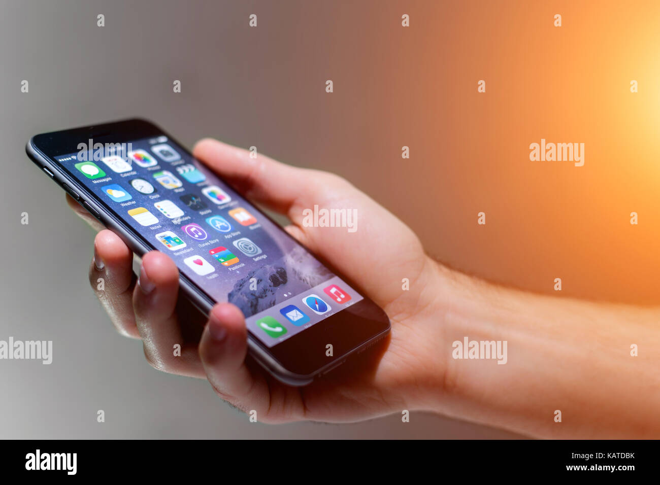 View of a Hand holding black smartphone with operating system screen ...