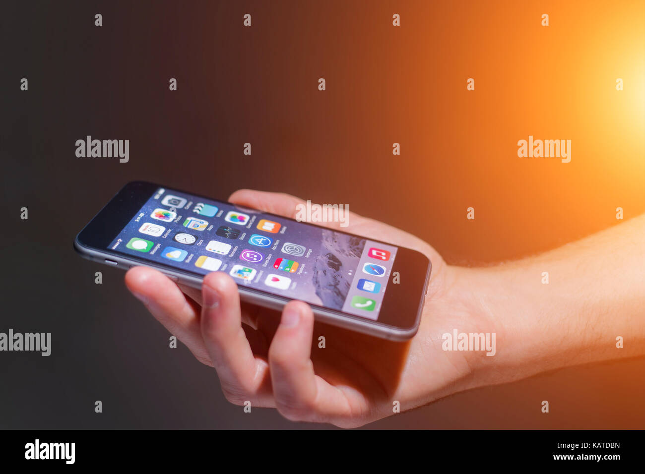 View of a Hand holding black smartphone with operating system screen ...