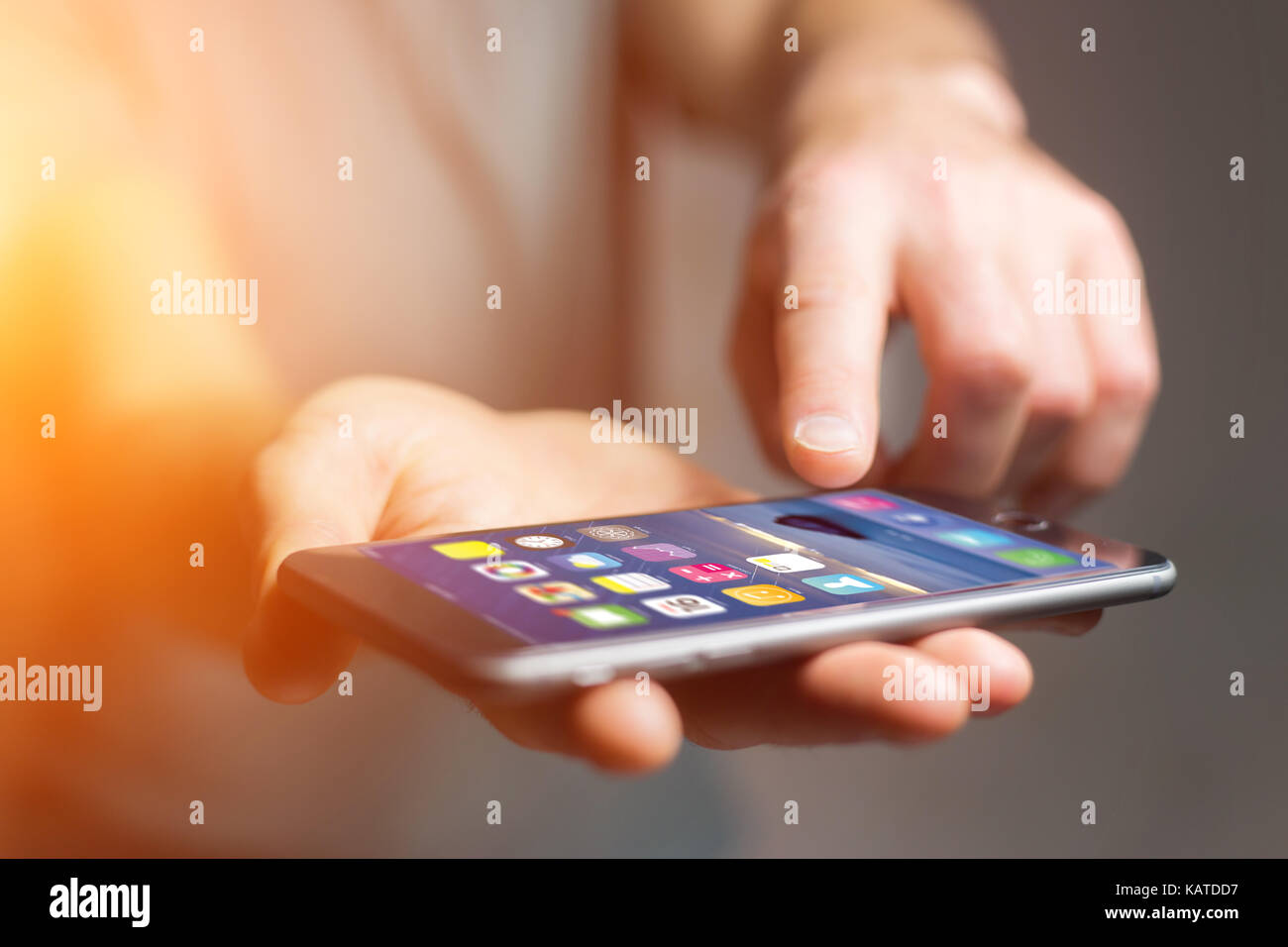 View of a Hand holding black smartphone with operating system screen ...