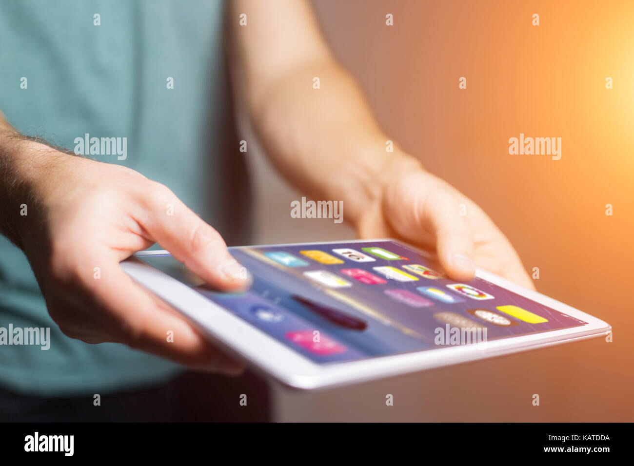 View of a Hand holding black tablet with operating system screen Stock ...