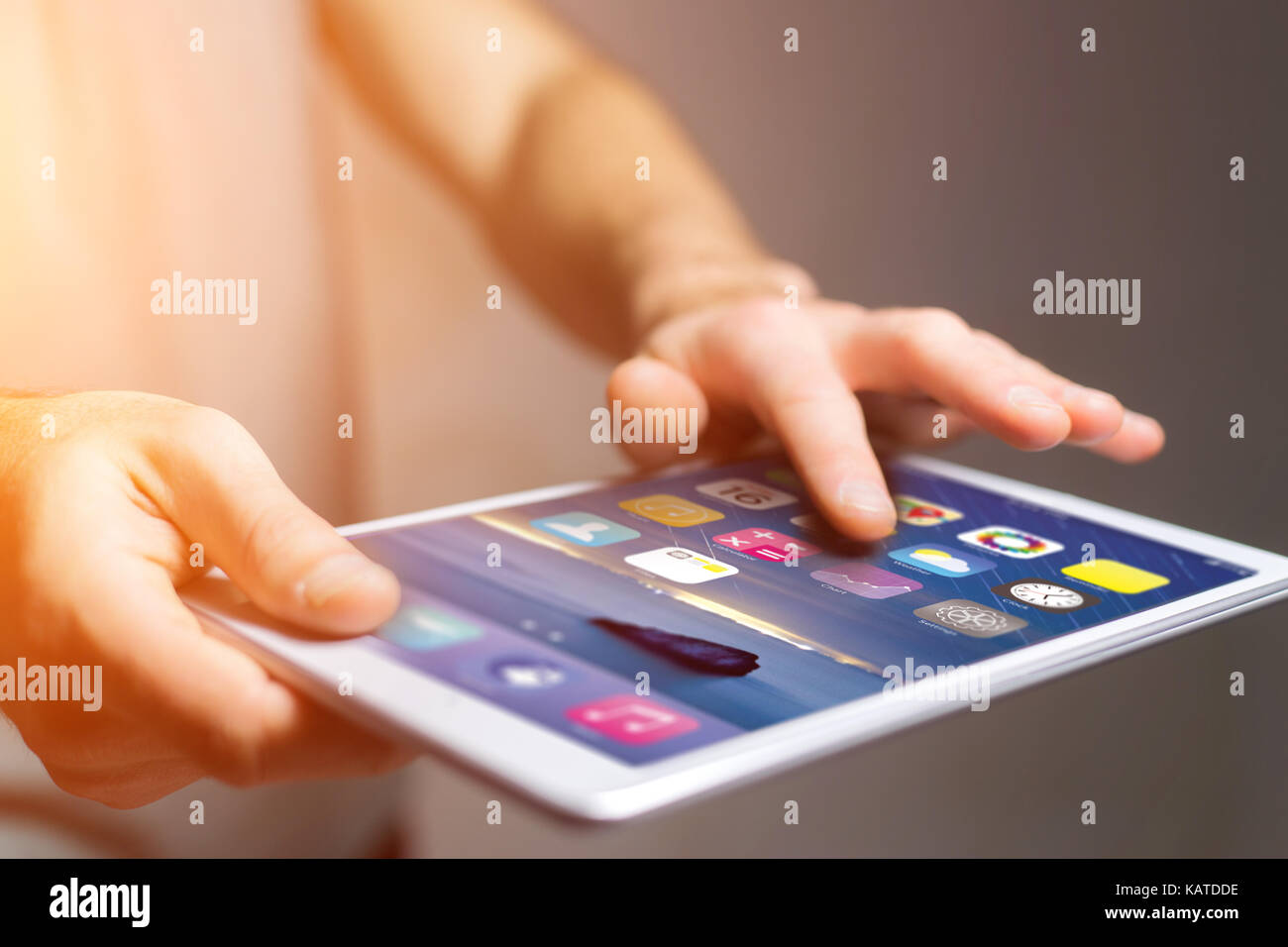 View of a Hand holding black tablet with operating system screen Stock ...