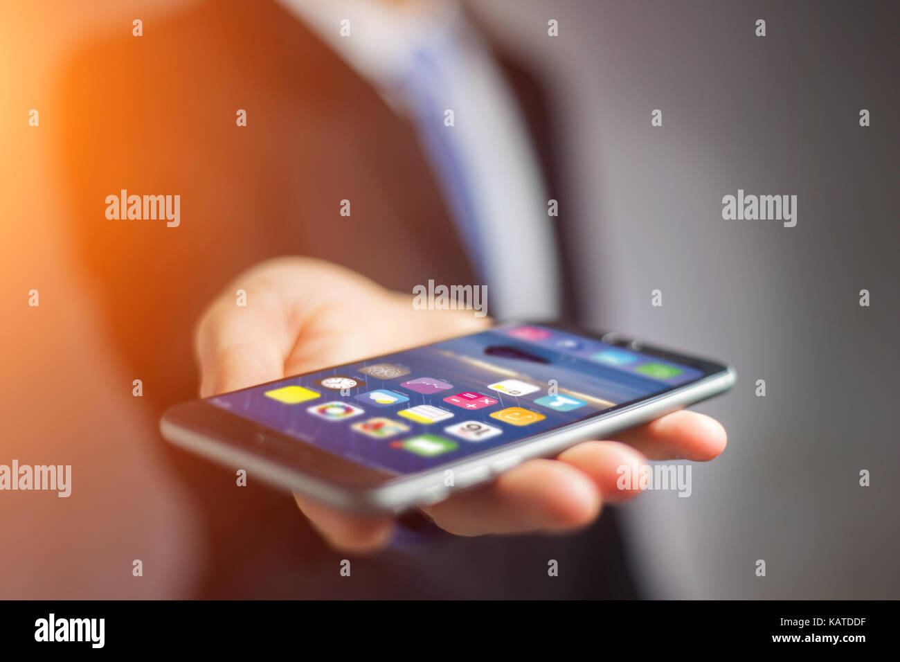 View of a Hand holding black smartphone with operating system screen ...