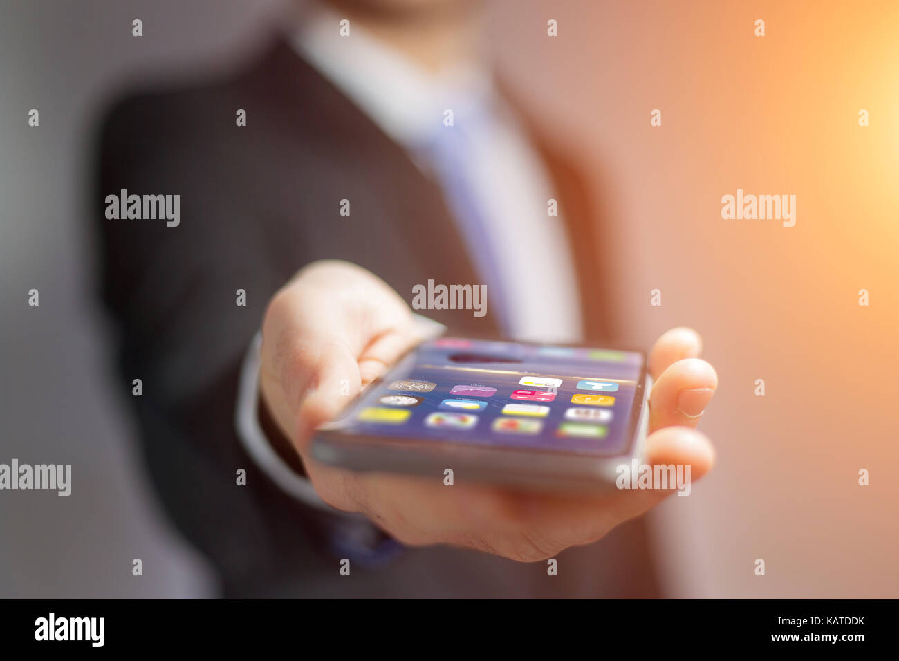 View of a Hand holding black smartphone with operating system screen ...