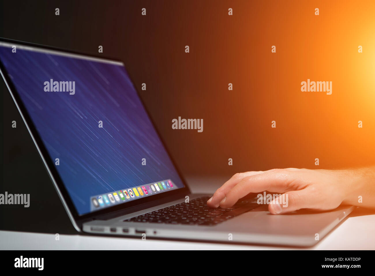 View of a Hand typing on a keyboard of laptop with operating system ...