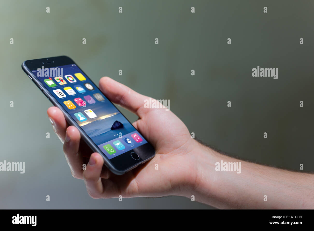 View of a Hand holding black smartphone with operating system screen ...