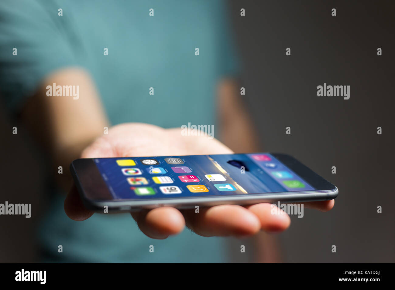 View of a Hand holding black smartphone with operating system screen ...