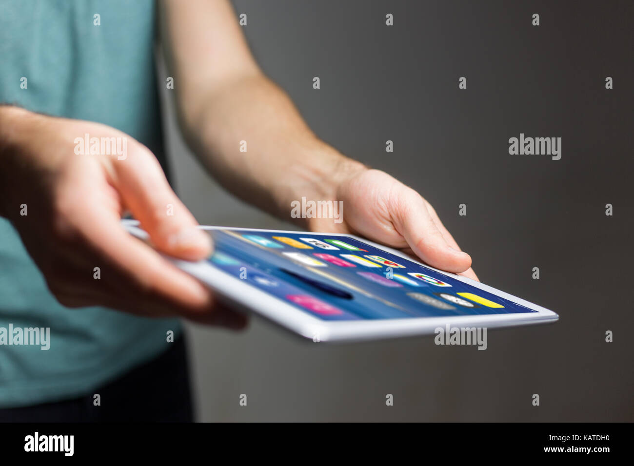 View of a Hand holding black tablet with operating system screen Stock ...
