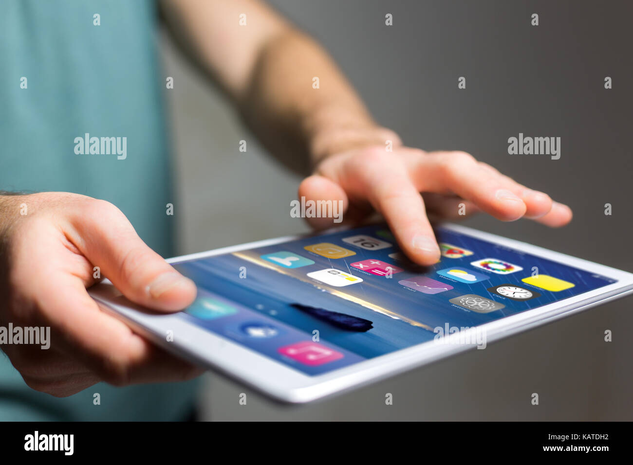 View of a Hand holding black tablet with operating system screen Stock ...