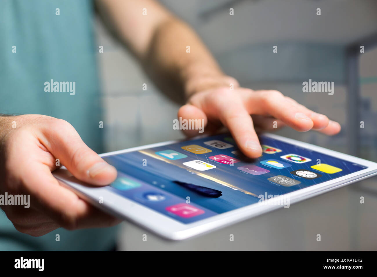 View of a Hand holding black tablet with operating system screen Stock ...
