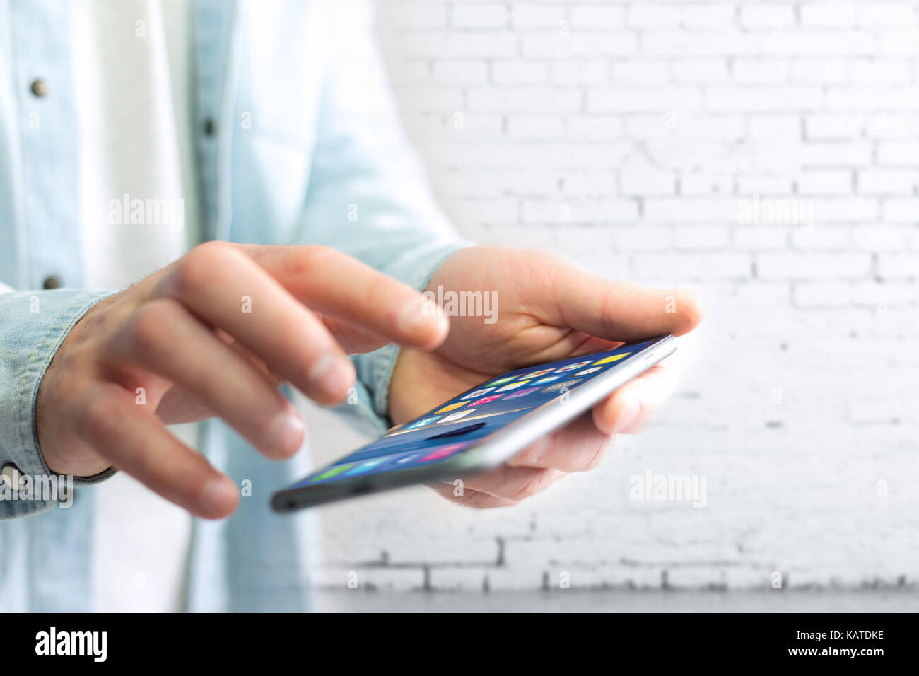 View of a Hand holding black smartphone with operating system screen ...