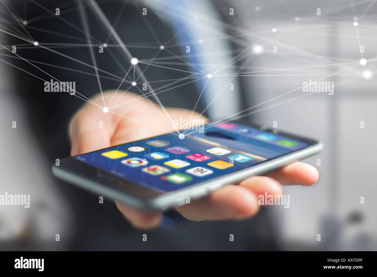 View of a Hand of a businessman holding smartphone with operating ...