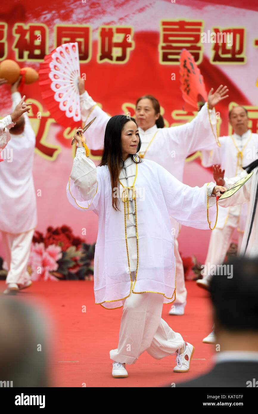 Beijing, China. 27th Sep, 2017. Citizens perform Tai Chi during a ...