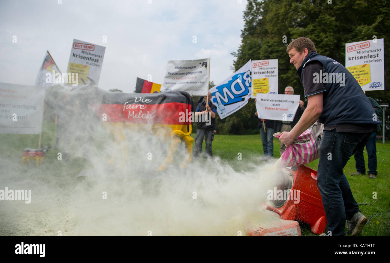 Dairy farmers blow milk powder over a meadow in Neetze, Germany, 27 ...