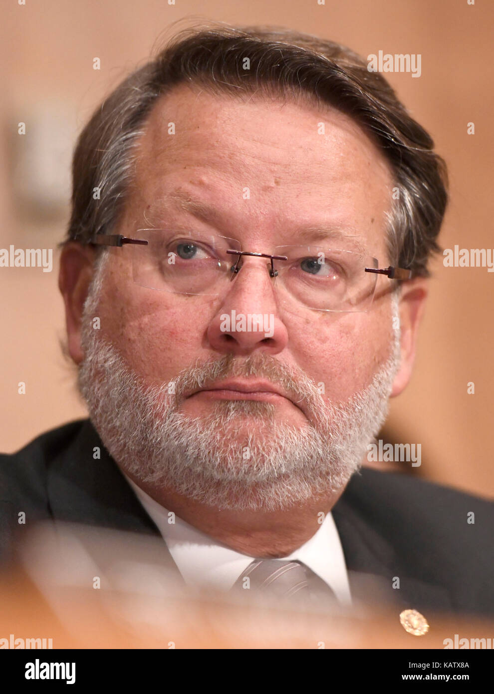 United States Senator Gary Peters (Democrat of Michigan) listens to ...