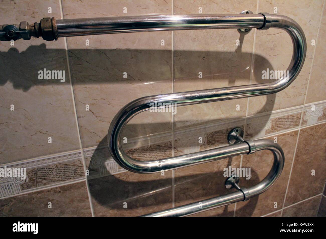 Shining worm-pipe for bathroom - fits perfectly into the interior Stock ...