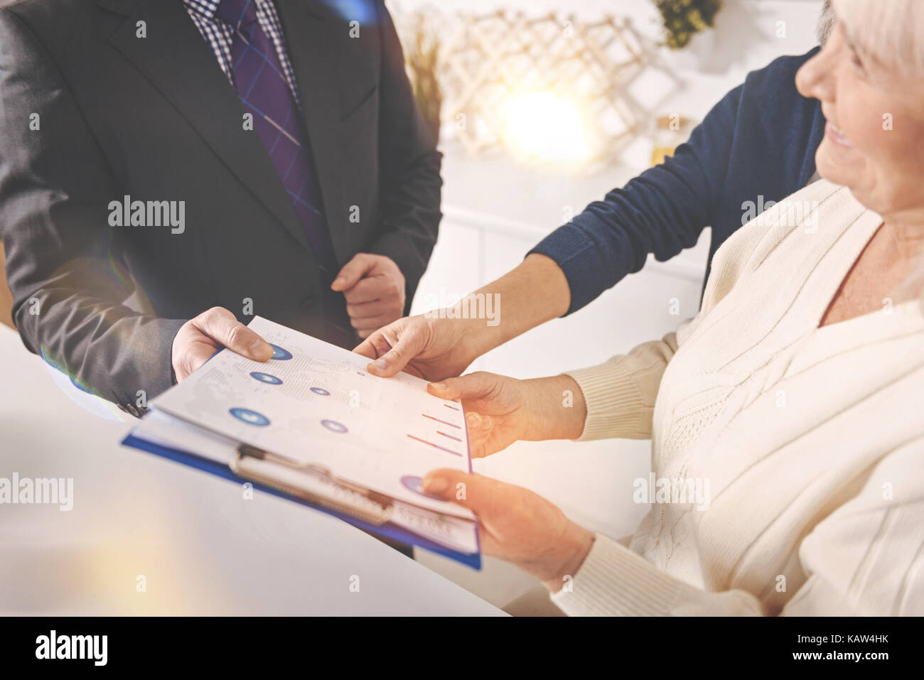 Positive old couple consulting with insurance agent Stock Photo - Alamy