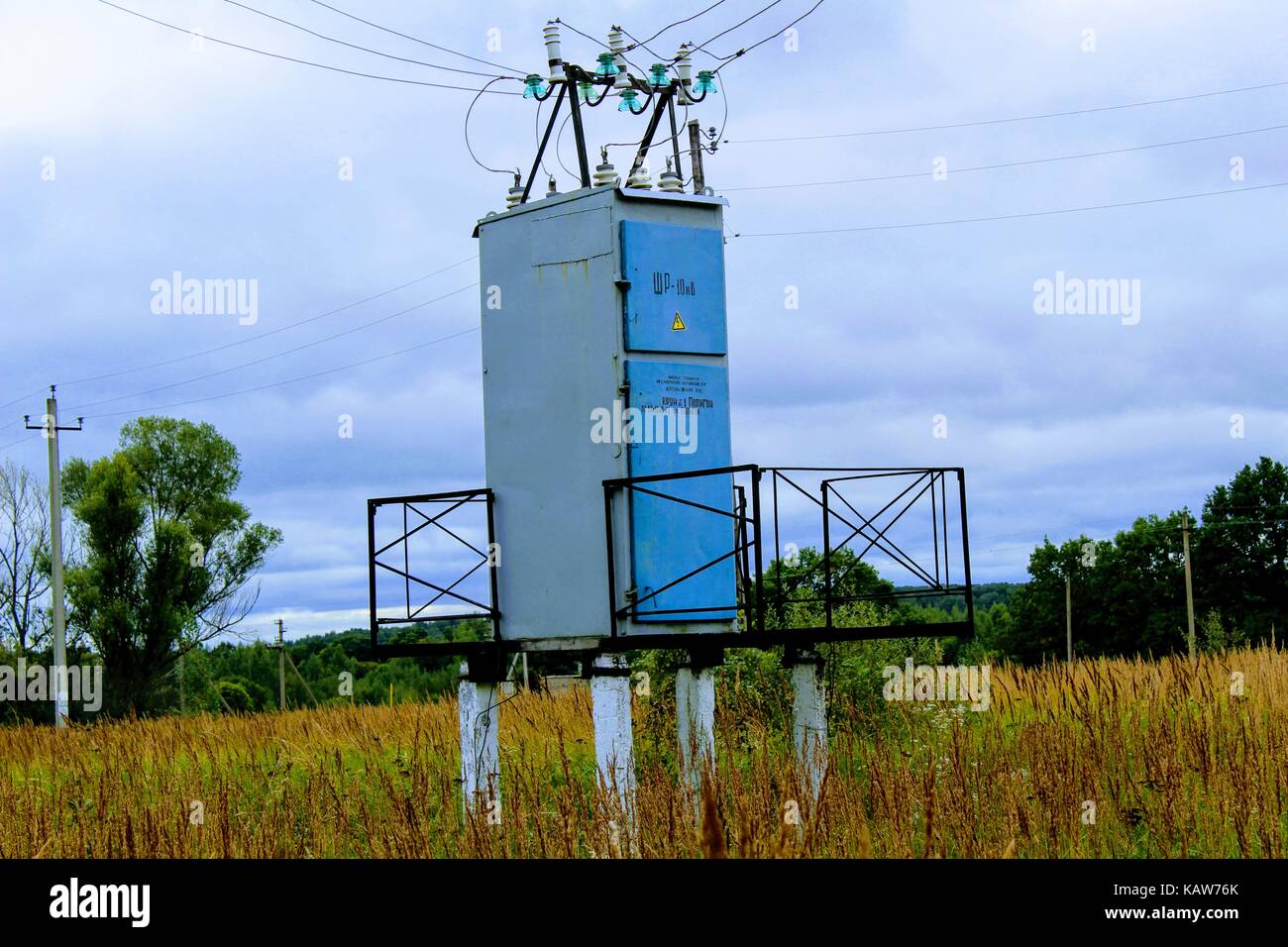 An electric transformer standing in the middle of the field Stock Photo ...