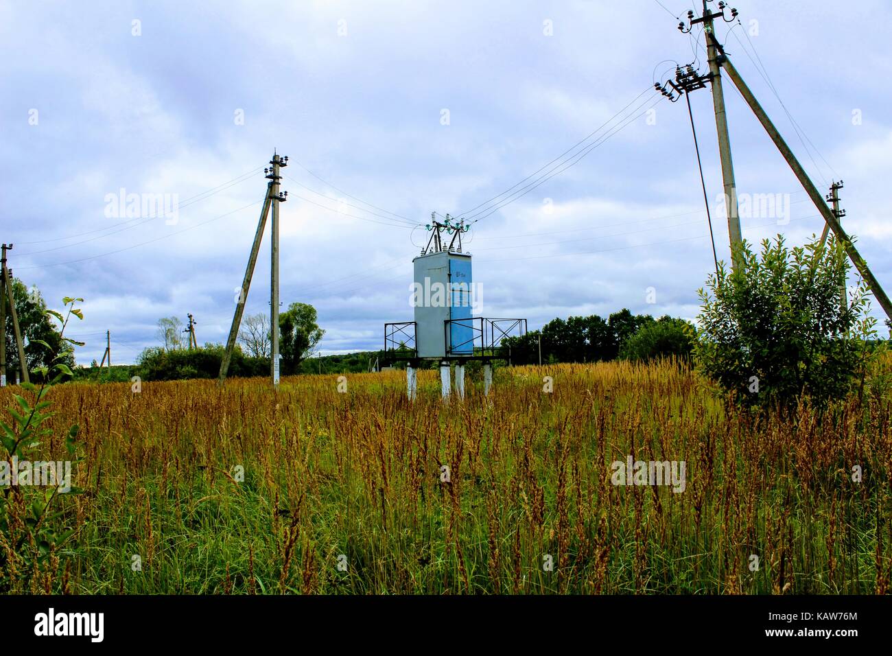 An electric transformer standing in the middle of the field Stock Photo ...